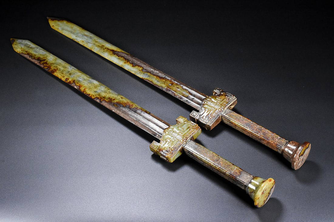 Two Chinese Hetian Jade Swords, 'animal Mask' Auction