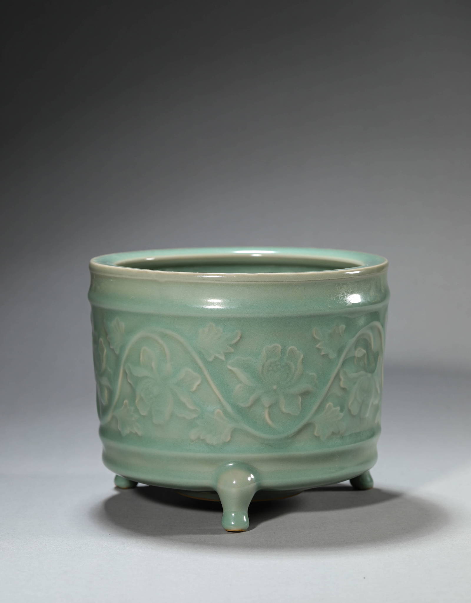 A Porcelain Longquan Interlock Branches Tripot Censer Auction