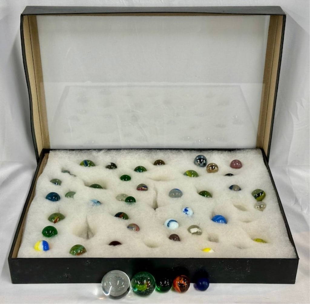 Collection Of Assorted Marbles In Display Case Auction