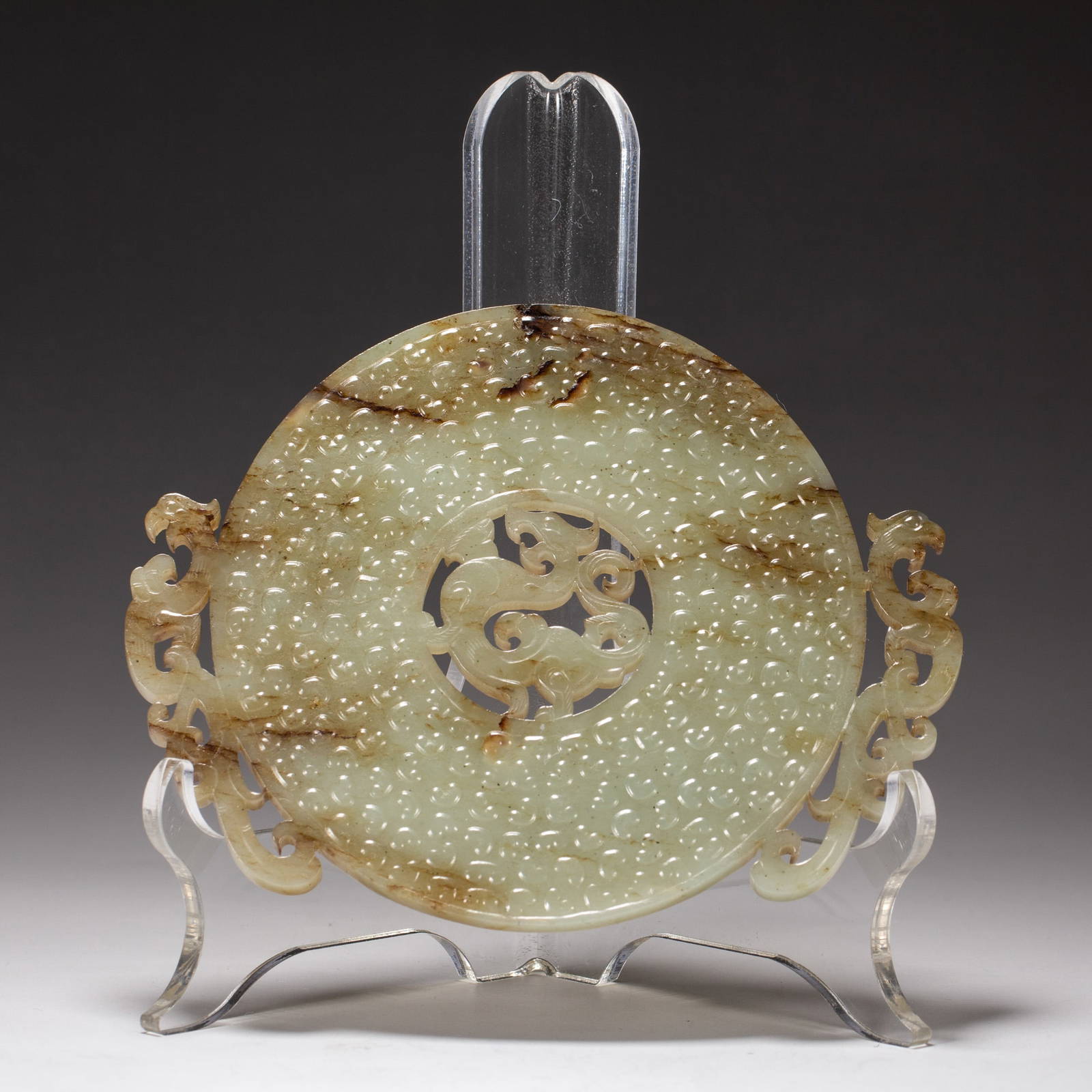 A Chinese Archaistic Carved Jade Disc Bi Auction