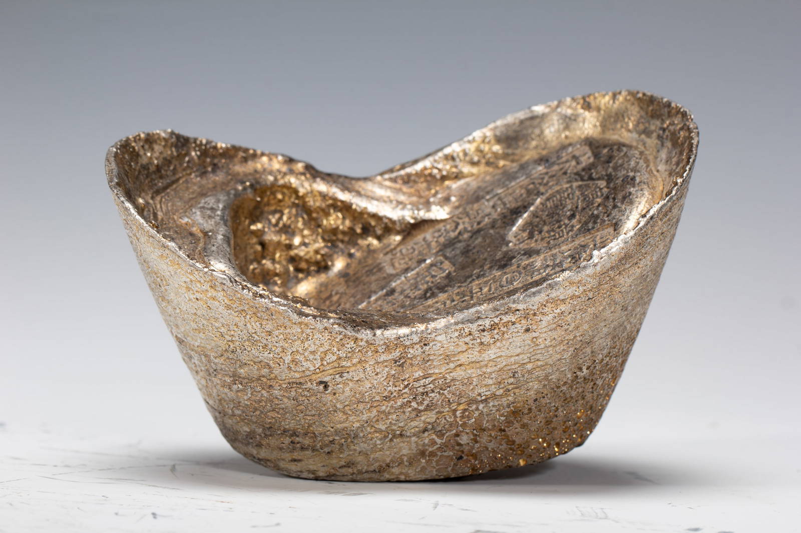 Boat - Shaped Silver Ingot Auction