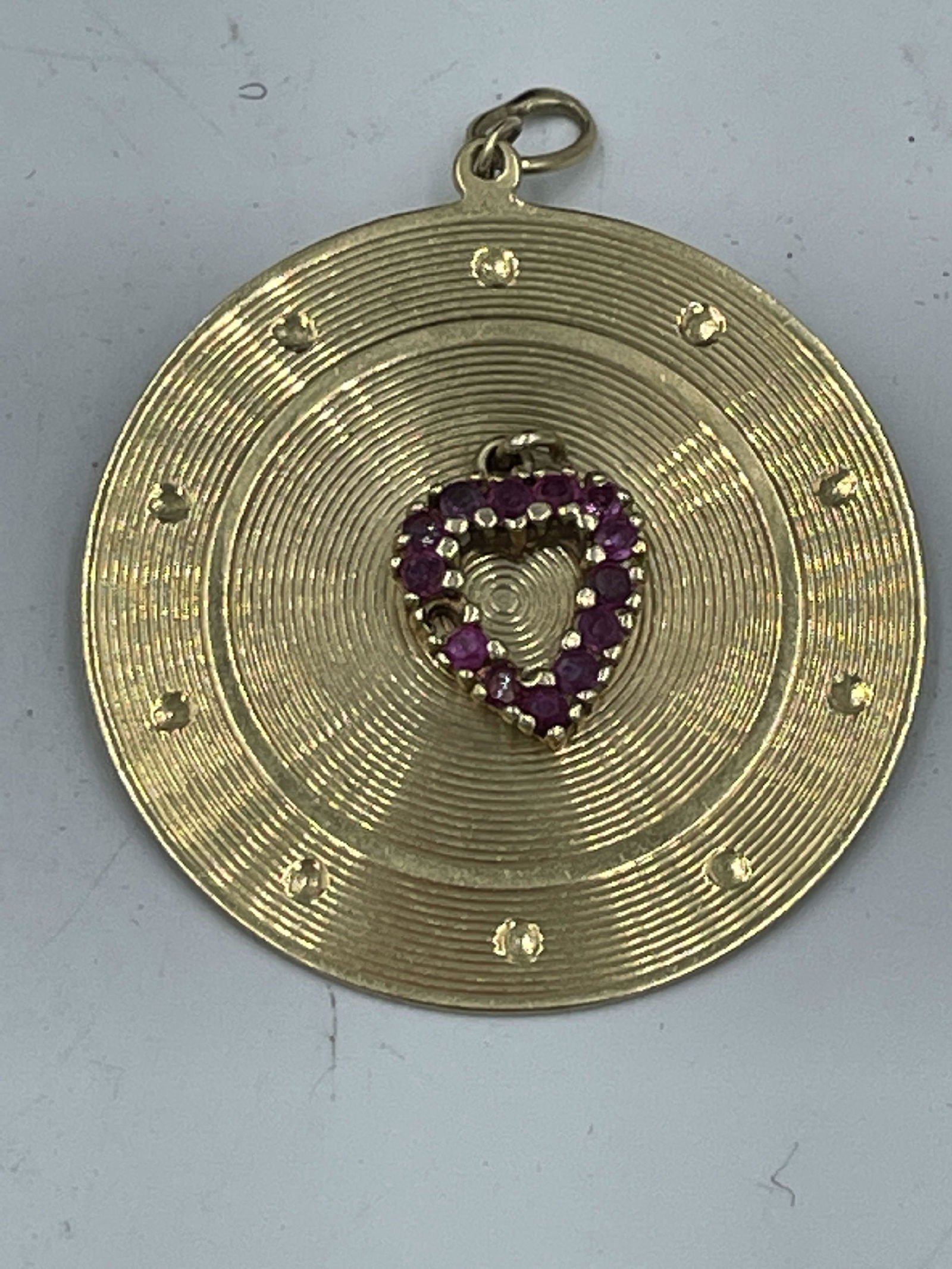 A 14kt. Yellow Gold Disc Pendant Containing A Total Of One Round Disc ...