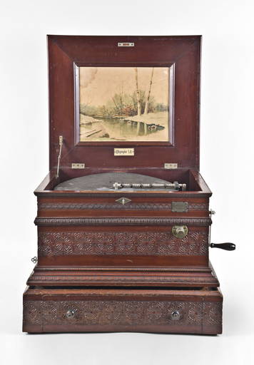 An Olympia model 5B coin operated disc music box with matching base ...