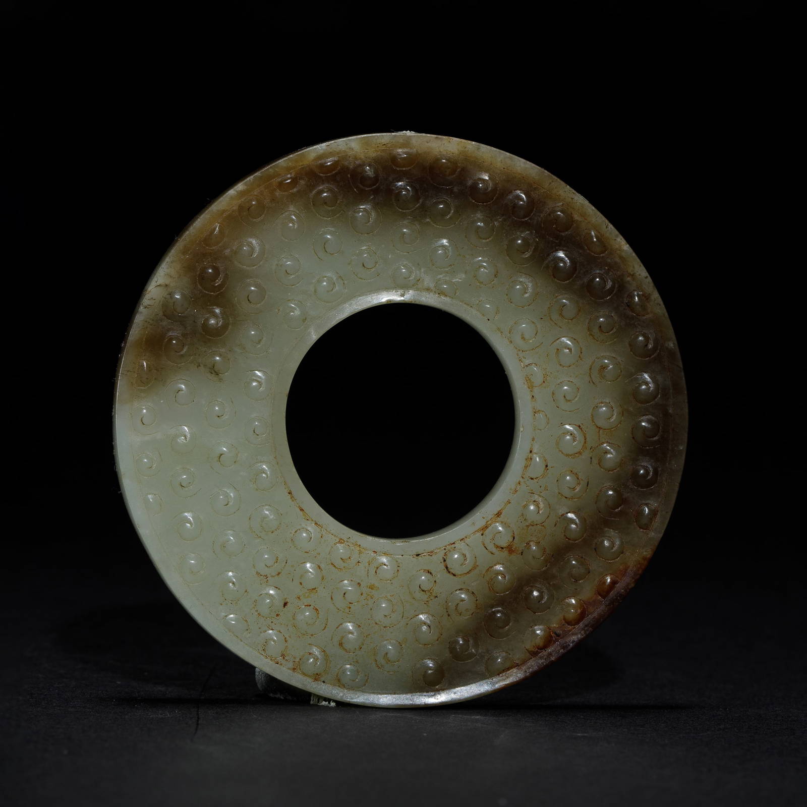 A Chinese Archaistic Carved Jade Disc Bi Auction