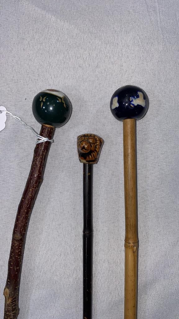 3 Porcelain Top Walking Sticks Auction