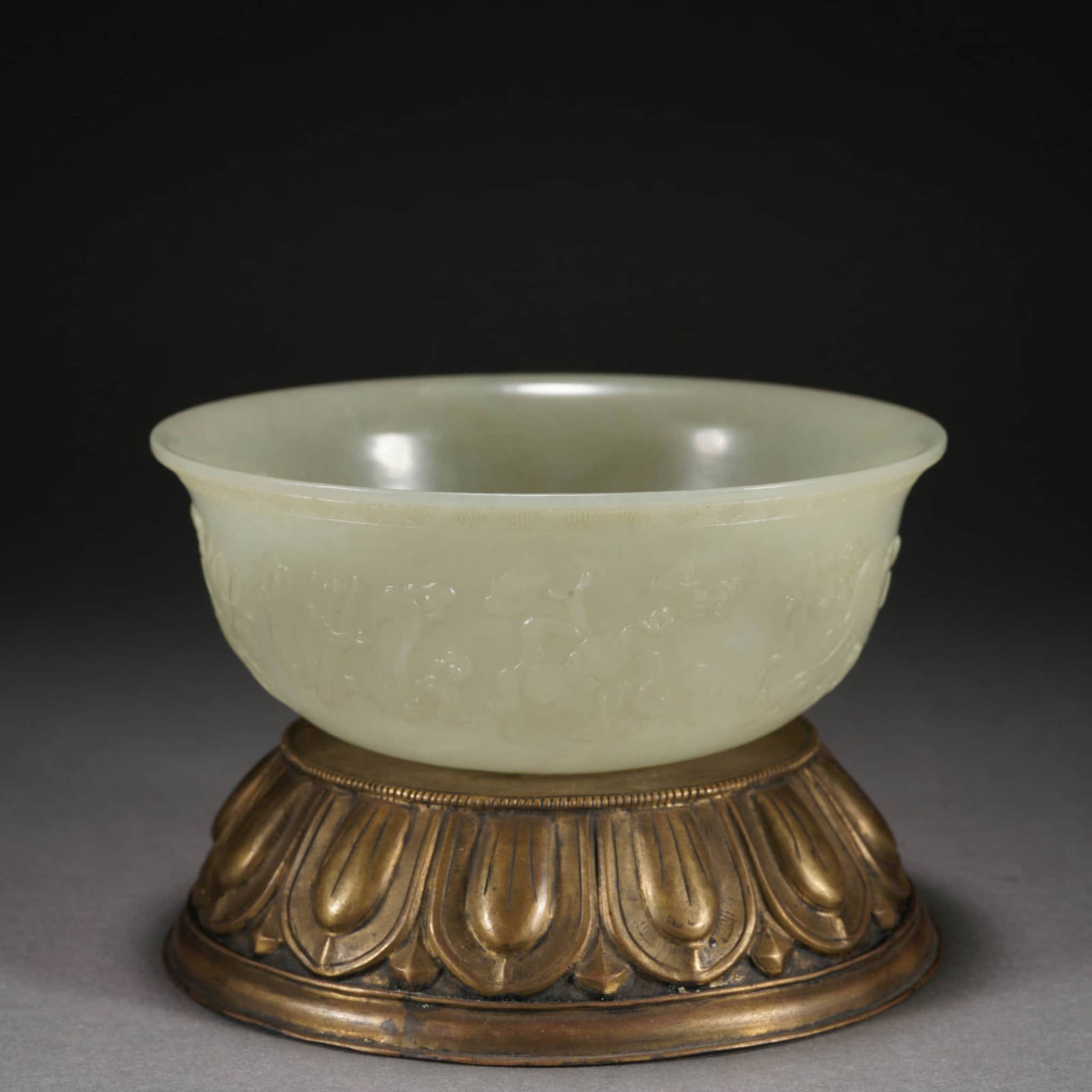 A White Jade Eight Buddhist Emblems Bowl Auction