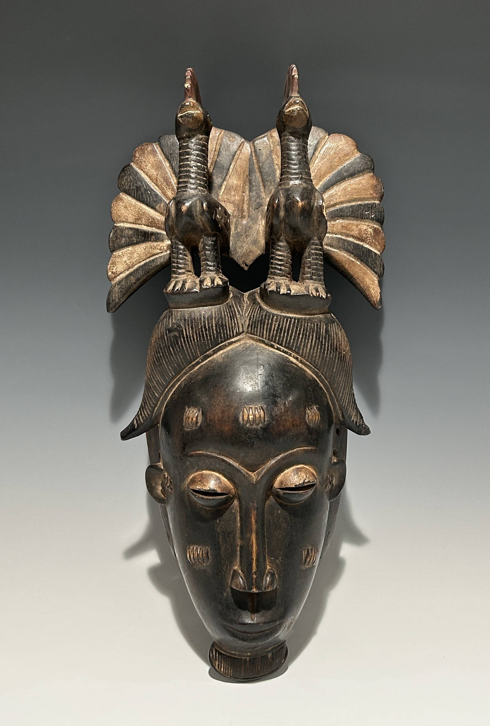 A Traditional African Ivory Coast Yohoure Wooden Kpelie Mask With Two ...