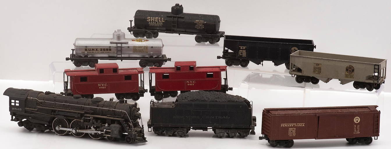 A Group Of Lionel Painted Metal Toy Trains