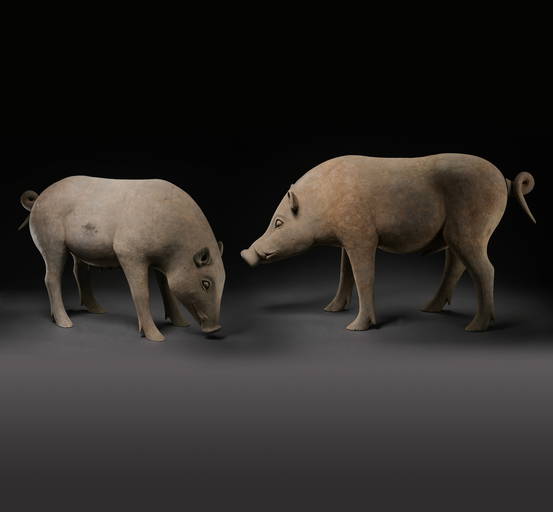 A Pair Of Chinese Pottery Pigs From The Han Dynasty
