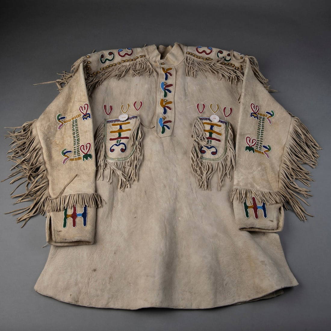 A Metis/teton Beaded Hide Scout Shirt Auction