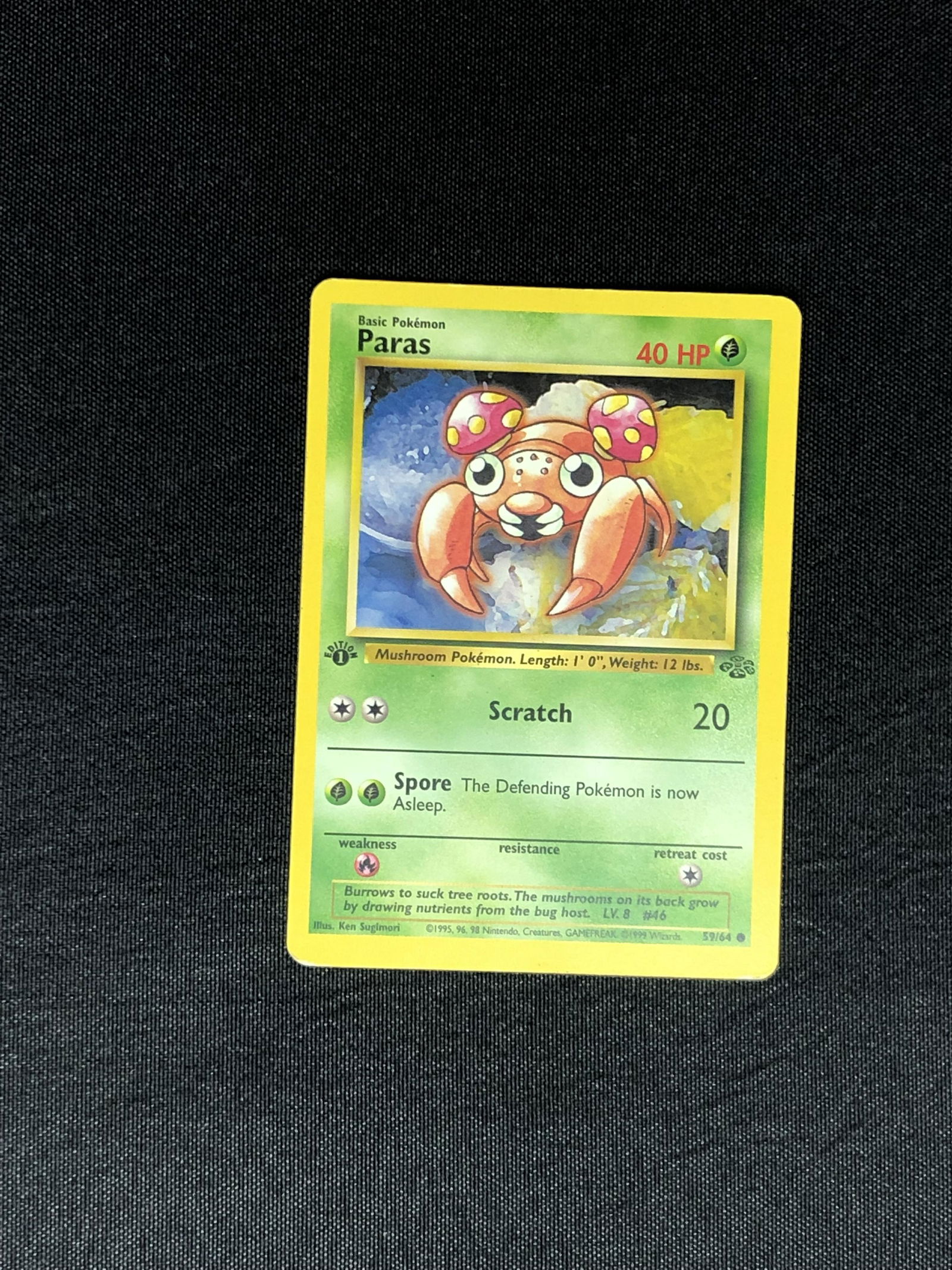 Paras 1st Edition Pokemon Card In Moderate Condition