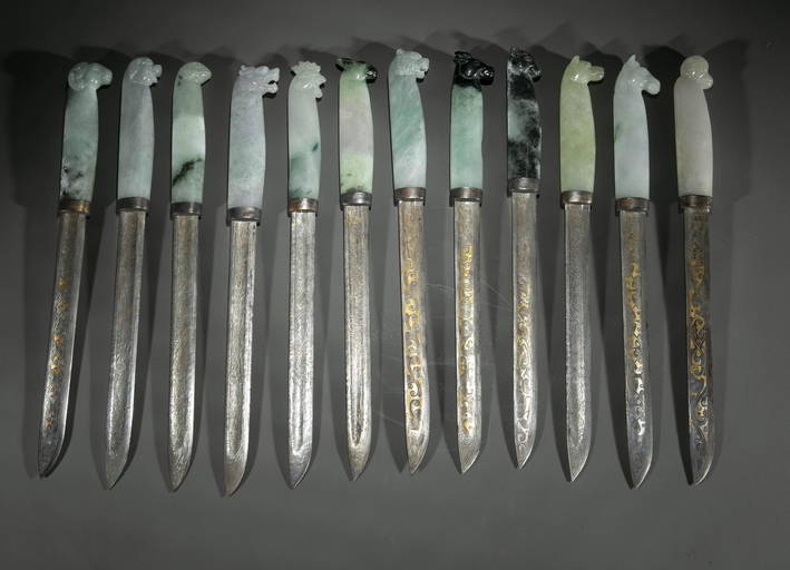 A Set Of Twelve Cast Iron Swords.