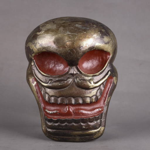 A Tibetan Bronze Chitipati Mask.