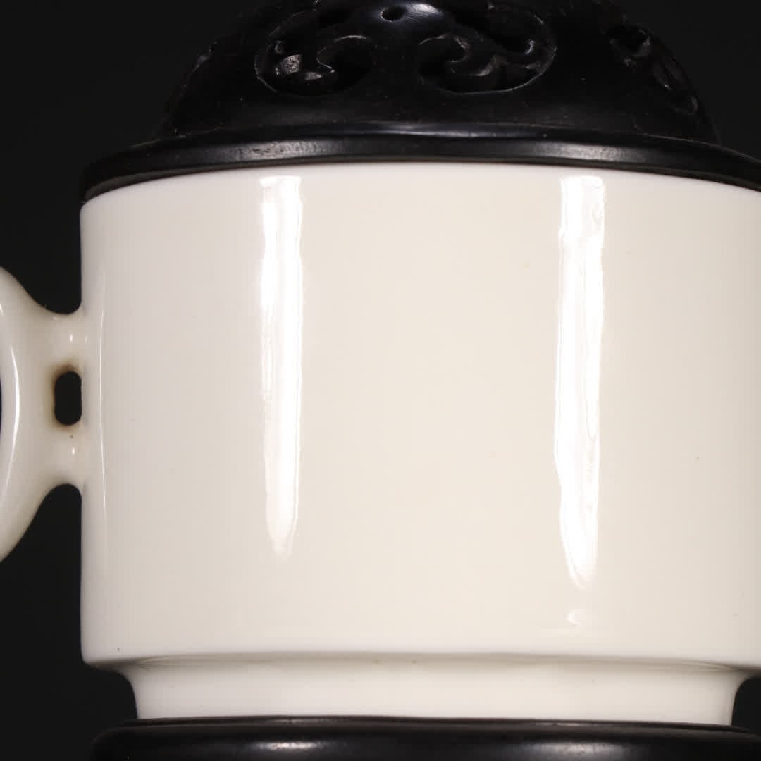 A Qing Dehua White Porcelain Double-halberd-handled Incense Burner Auction