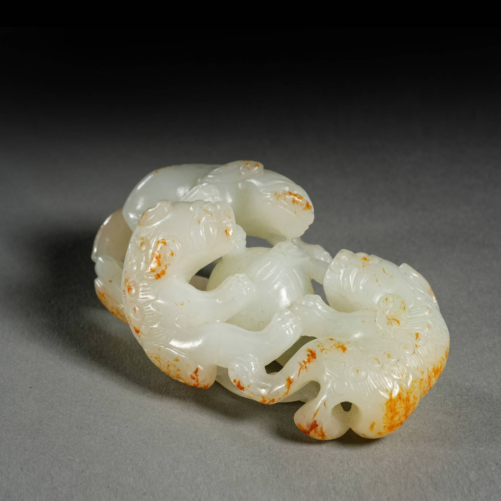 Qing Dynasty Hetian Jade Three Lions Playing Ball Ornament Auction