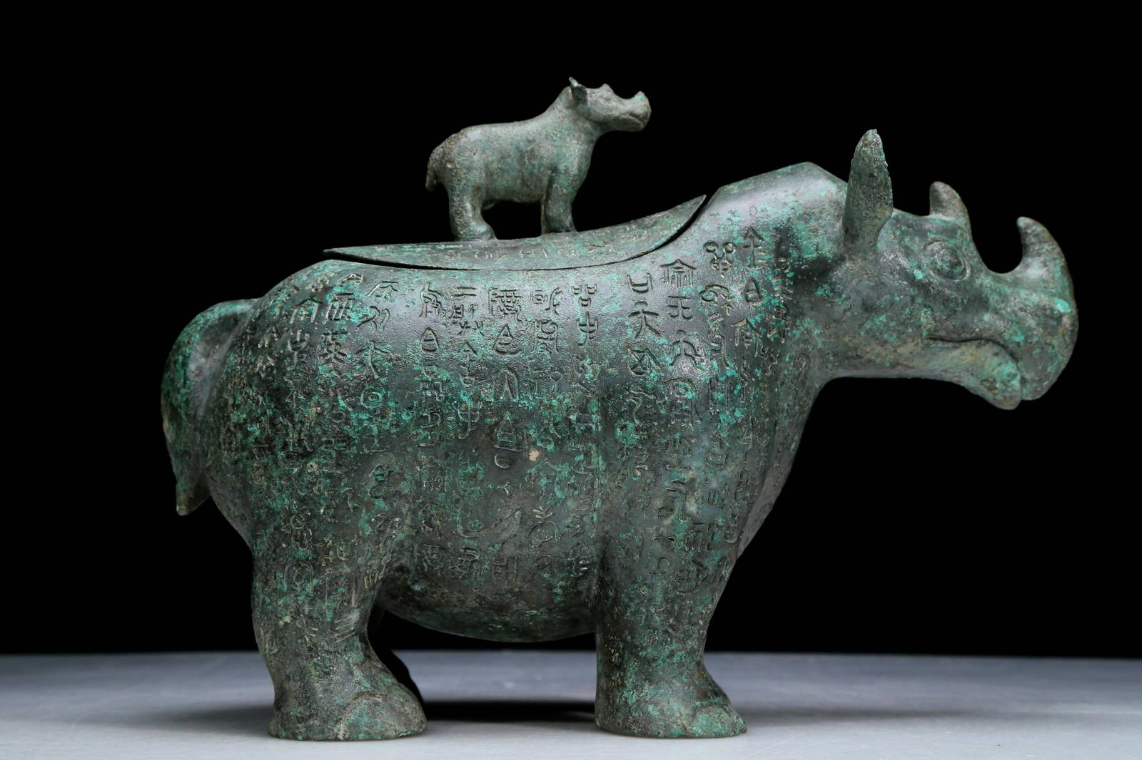 An Archaic Bronze Rhinoceros-form Jar With Inscriptions Auction