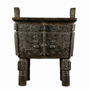 An Archaic Bronze 'taotie' Quadripod Ritual Food Vessel, Ding , With ...