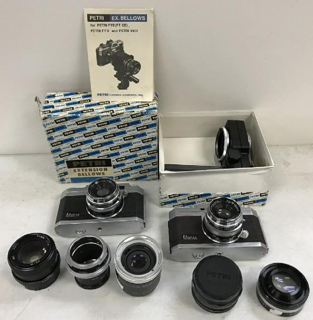PETRI CAMERAS, LENSES AND EXTENSION BELLOWS IN BOX,