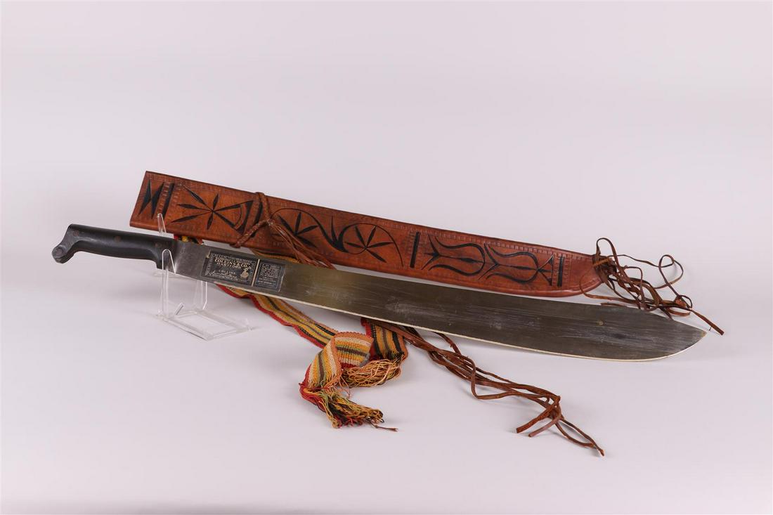 A Machete In A Leather Sheath, South America. 20th Century.