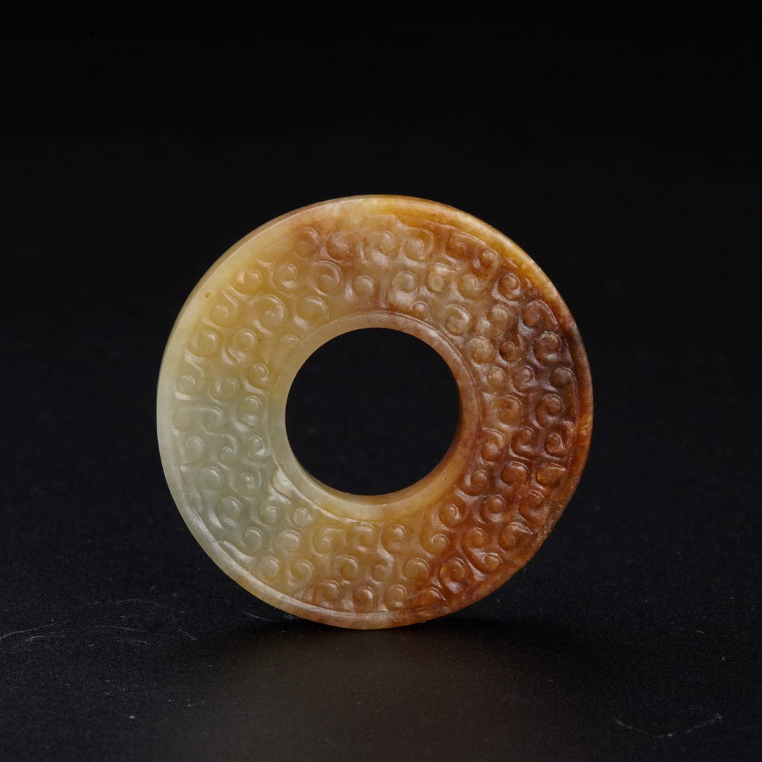 A White And Russet Jade Bi Disc, Han Dynasty Or Later Auction