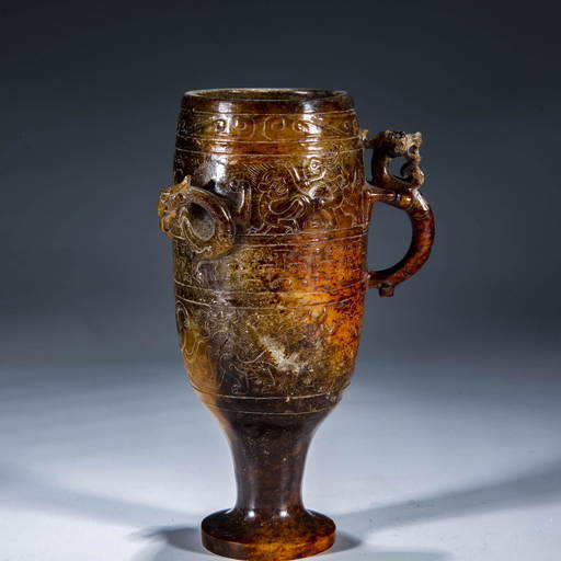 An Ancient Jade Cup With Dragon Shaped Handle.