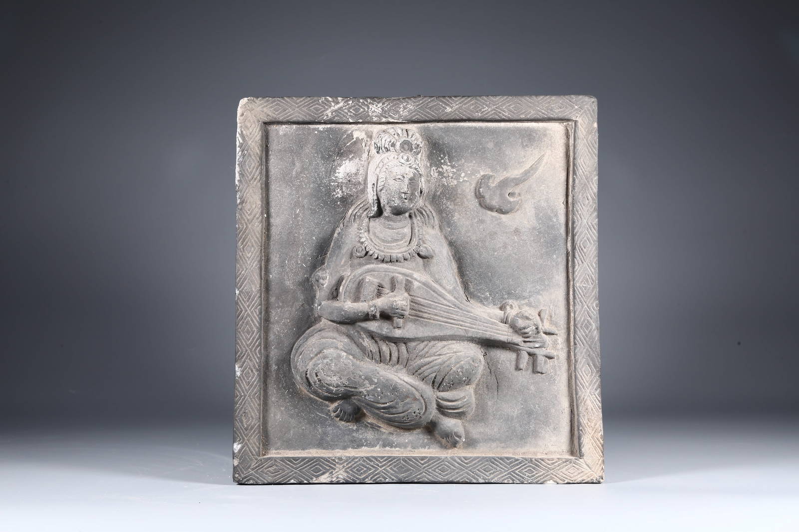 A Figuline Brick, Carved Apsaras Design. Auction