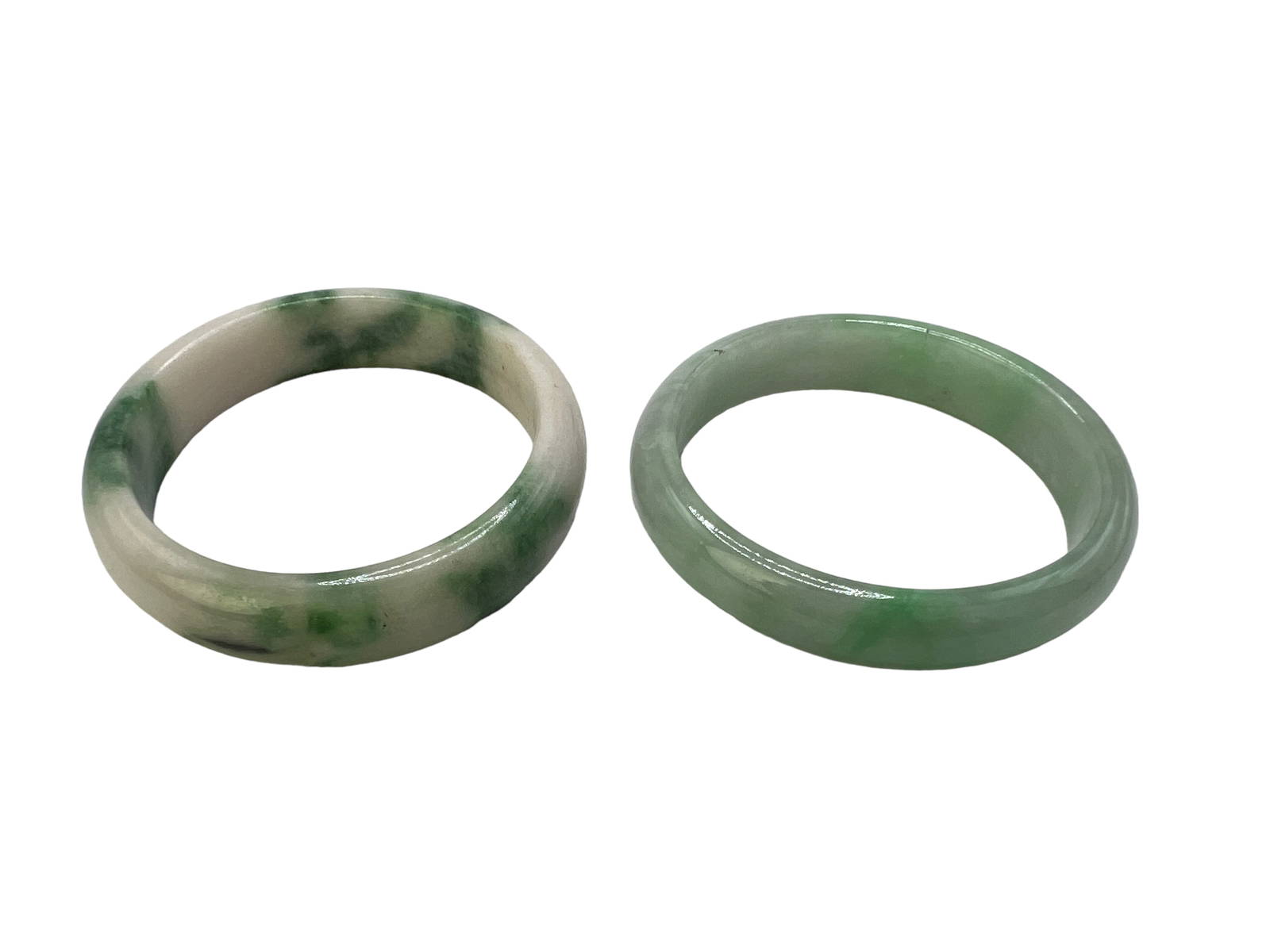 Two Jade / Green Stone Bangles Auction