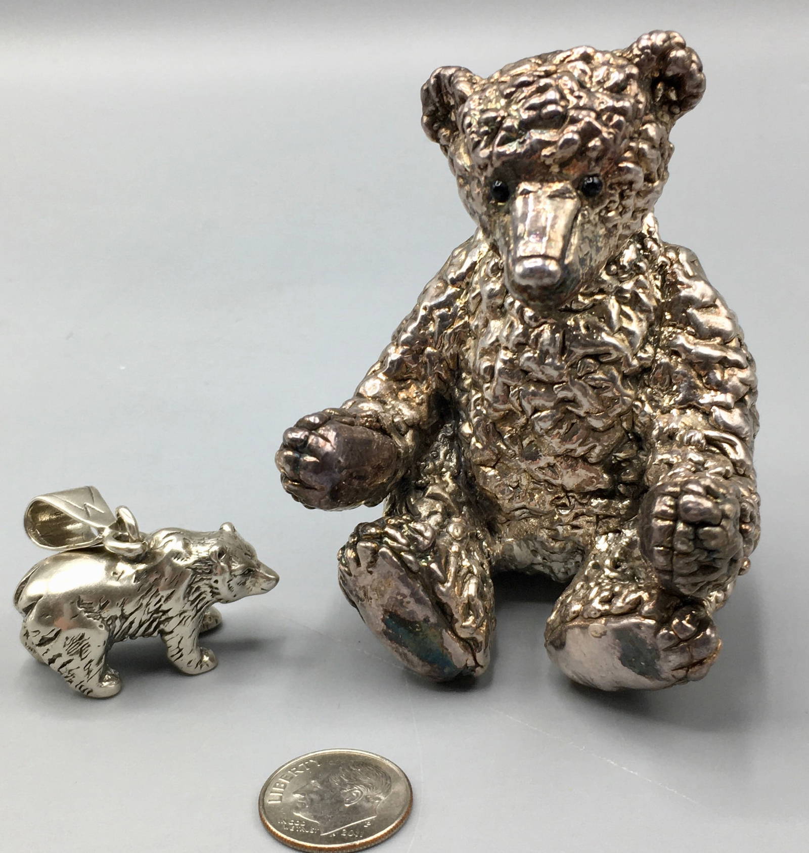 A Silver Bear Pendant And A Sterling Silver Teddy Bear Auction