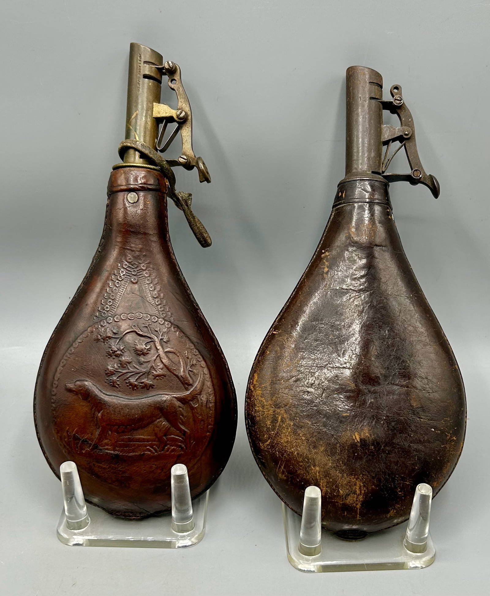 Two Leather Shot Flasks, One By Am Flask And Cap Auction