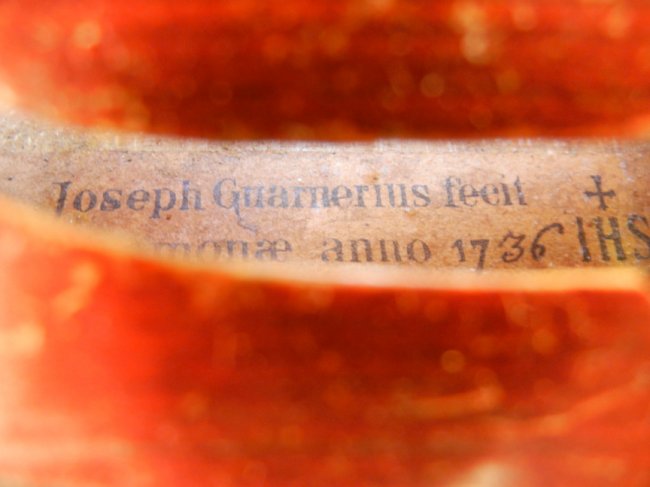 Joseph Guarnerius violin in case, label inside violin m : Lot 519