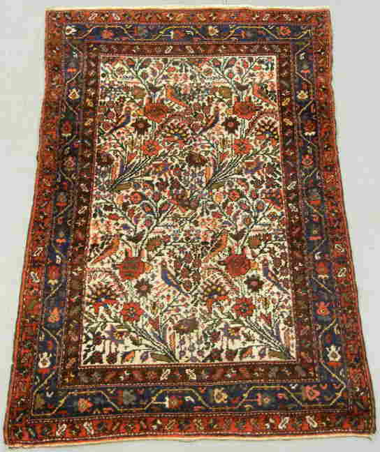 Hand tied Persian rug, Made in Iran cloth label, red bo
