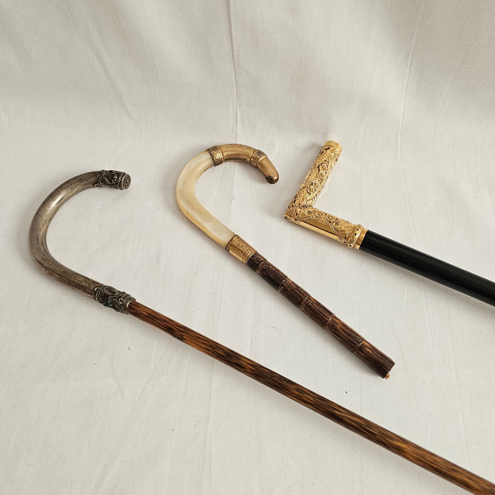 Grouping Of Two Walking Sticks And Cane Top
