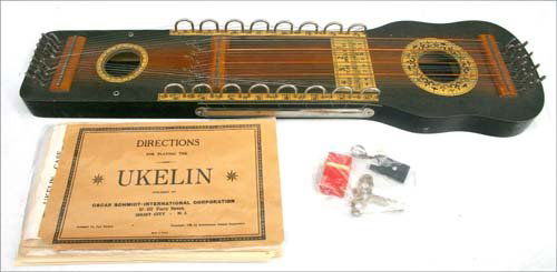97: antique Ukelin musical instrument w 1925 copyright