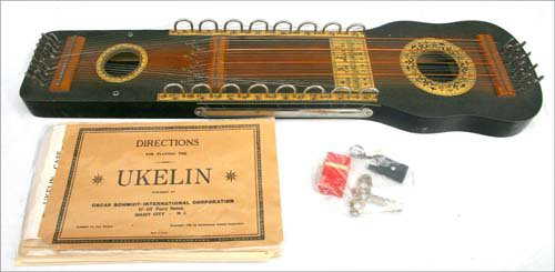 97: antique Ukelin musical instrument w 1925 copyright
