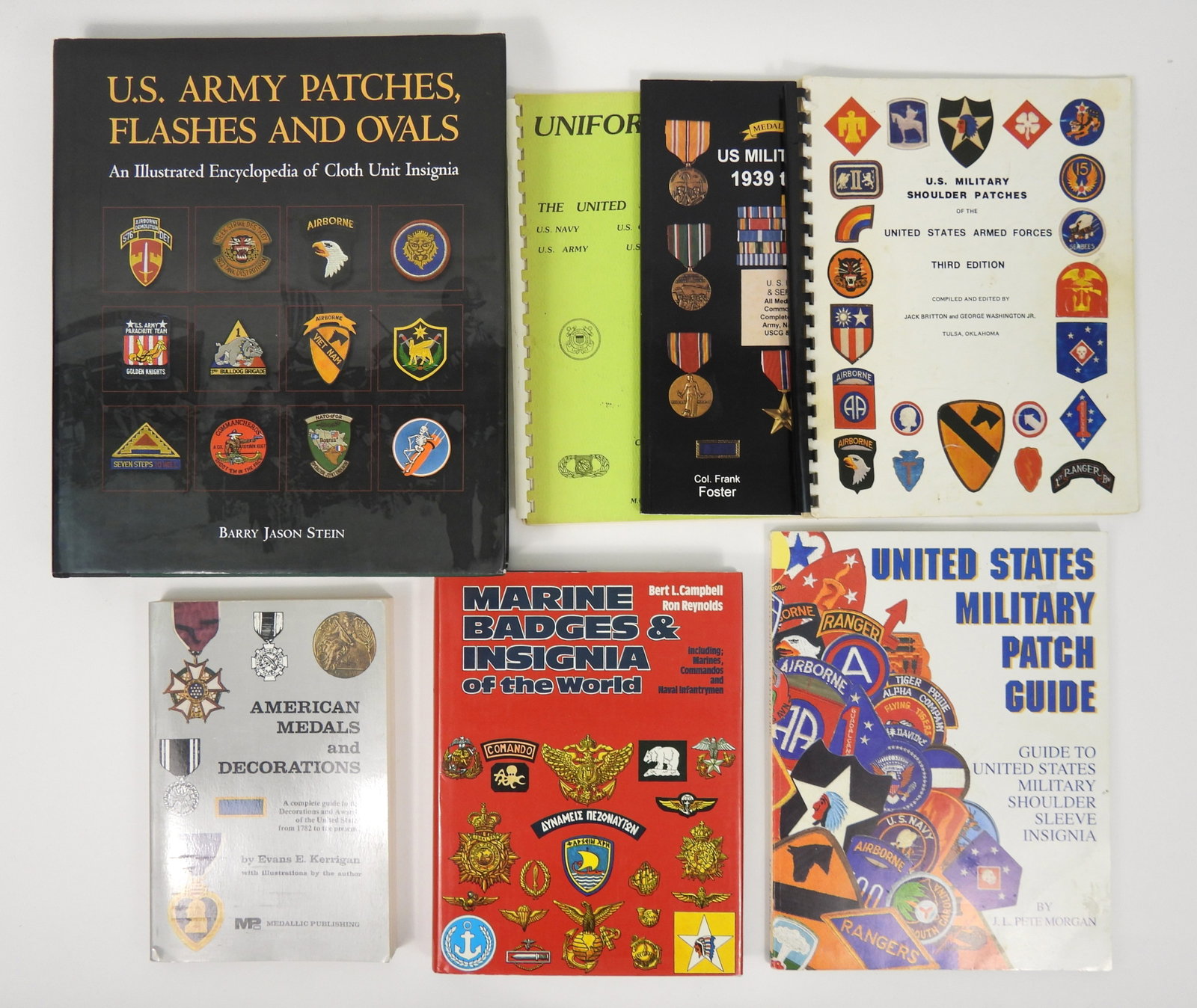 7pc Military Insignia Metals Patches Books Auction