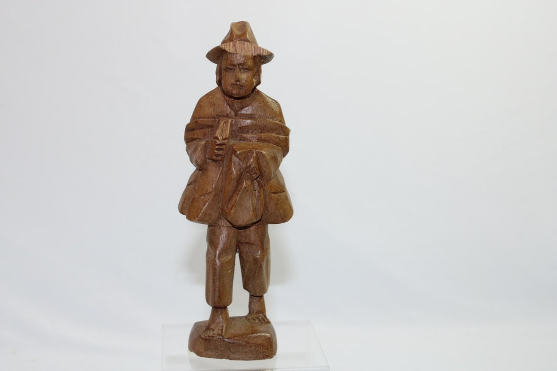 Carved Figurine Of A Wanderer Man Auction