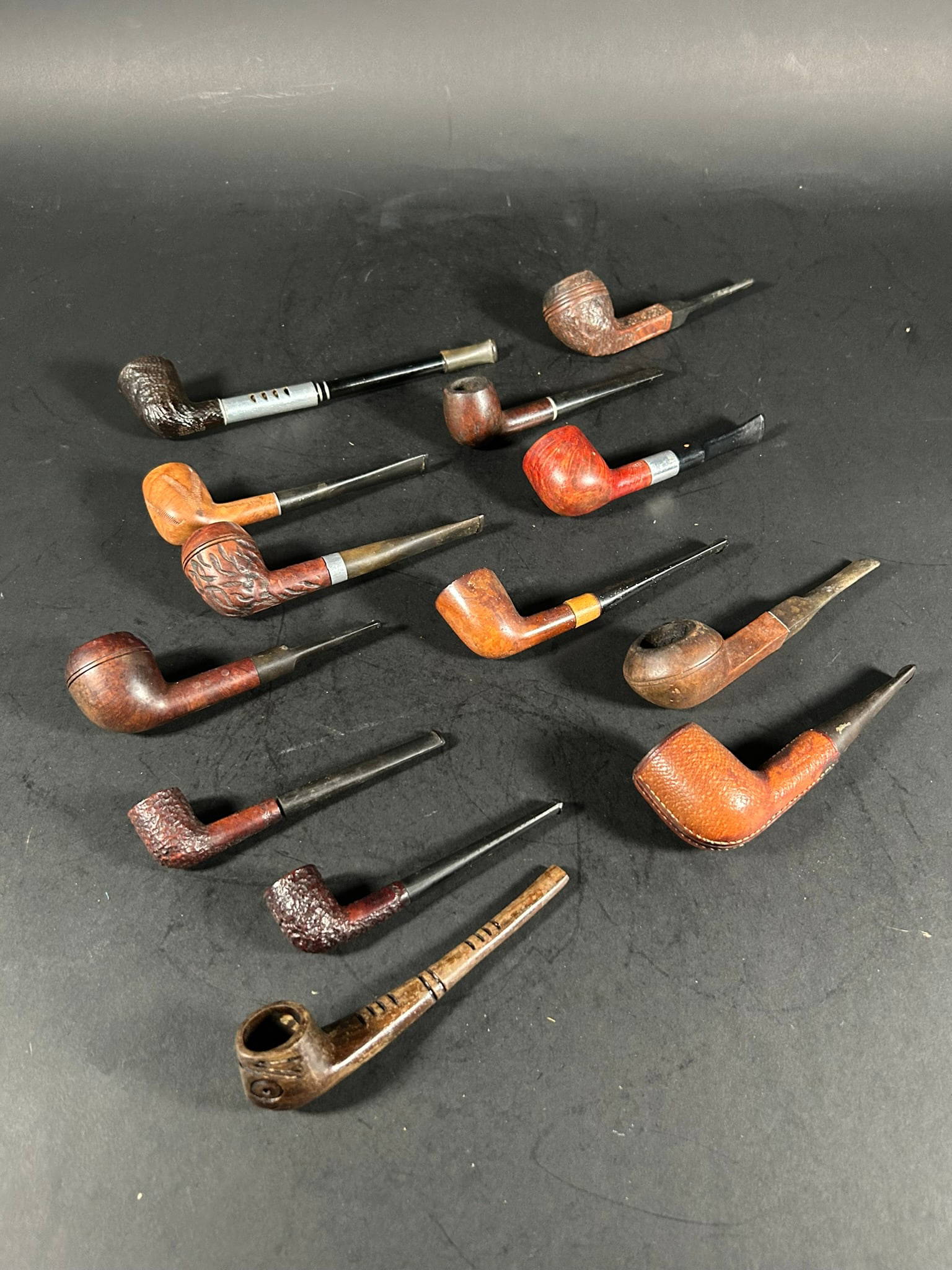 A Group Of Thirteen Smoking Pipes Auction