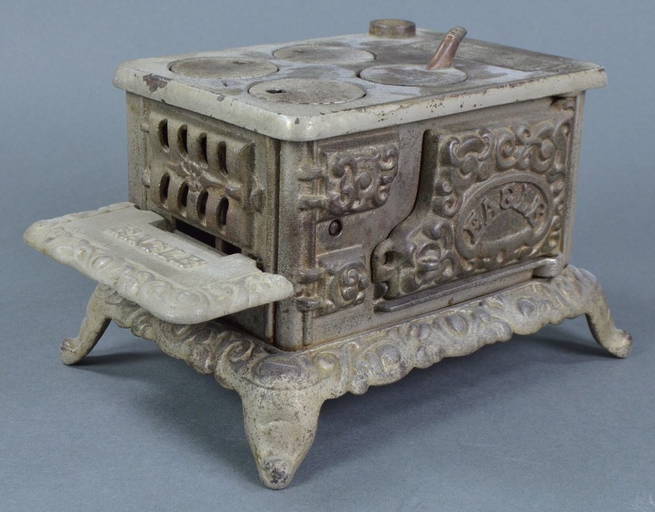 Four Cast Iron Toy Stoves