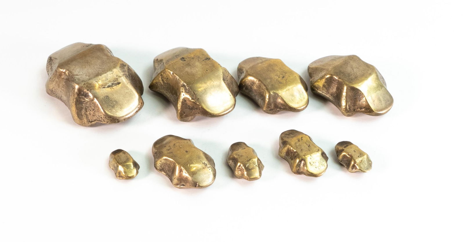 A Collection Of Eight Yunnan Province Silver Ingot Tael Saddle Shaped ...