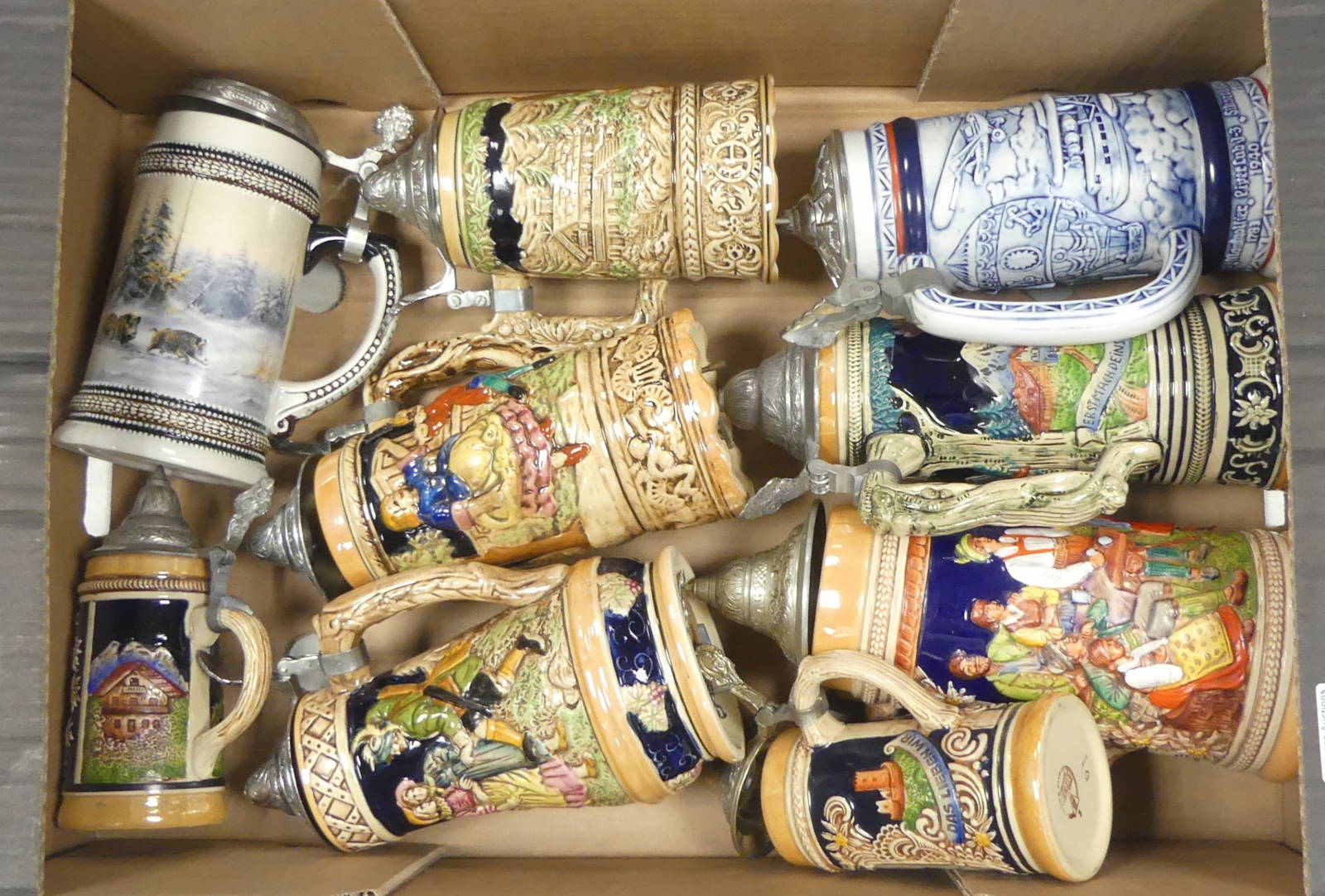 A Selection Of Decorative German Beer Steins Of Various Sizes, Some ...