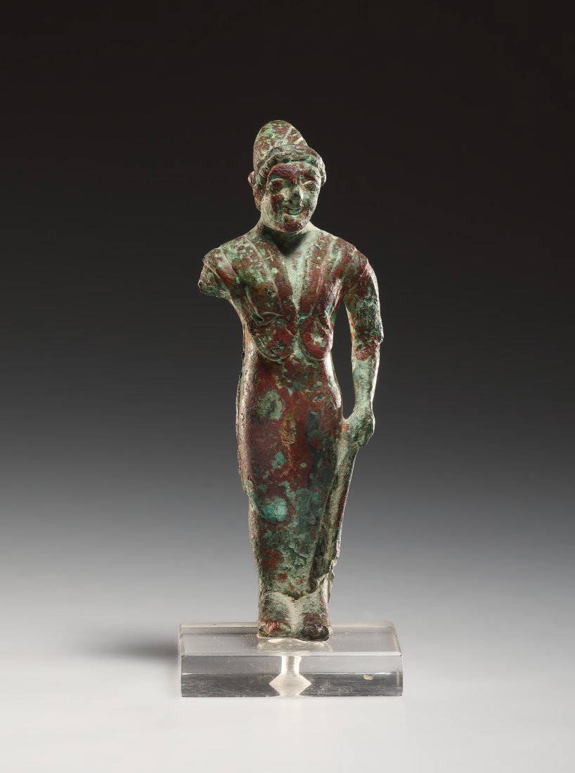 An Etruscan Bronze Statuette Of A Kore With Cloak Auction