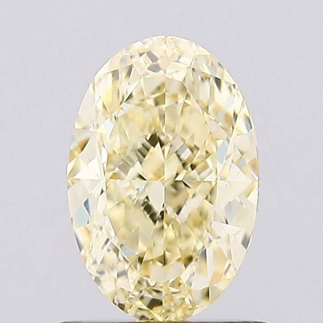 1.05 Ct, Fancy Yellow/vvs2, Oval Cut Igi Graded Diamond Auction