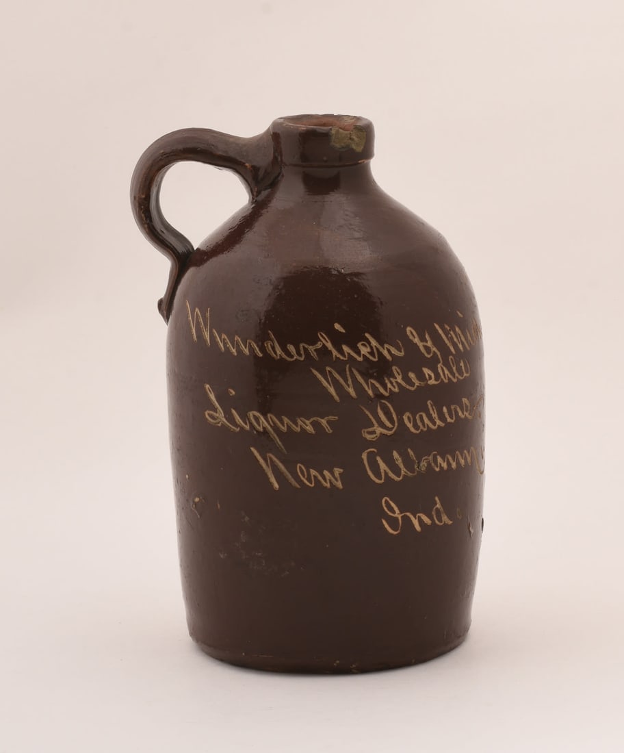 One Quart Advertising Jug Incised "wunderlich & Michel Wholesale Liquor ...