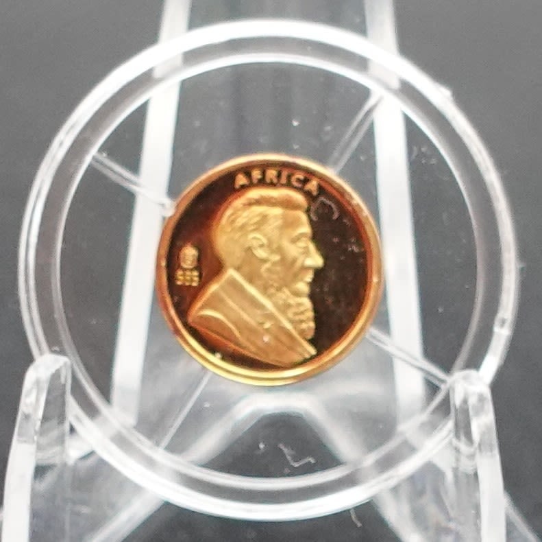 Worlds Smallest Gold Coin Auction