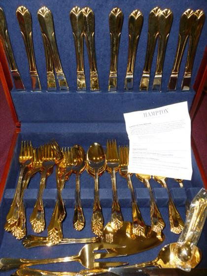 Gold plated flatware set in wood box