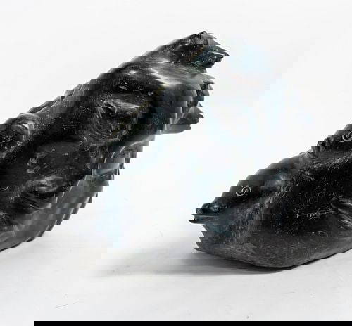 Inuit Head Sculpture Depicting A Face And Animals