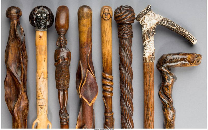 Eight Folk Art Carved Wood Canes 38 1/4 Inches High