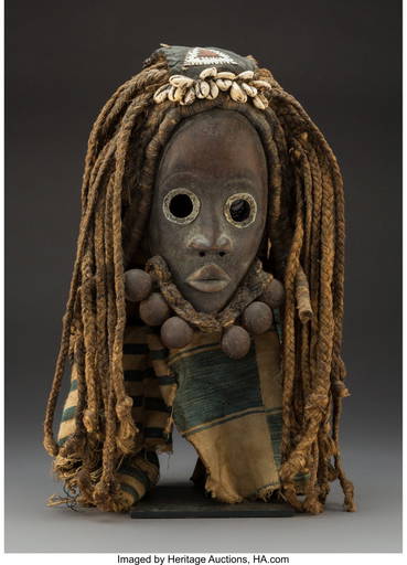 A Dan Mask With Attached Beard, Bells, And Fiber