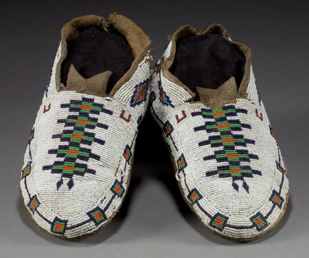 A Pair Of Plains Cree Beaded Hide Moccasins C. 1