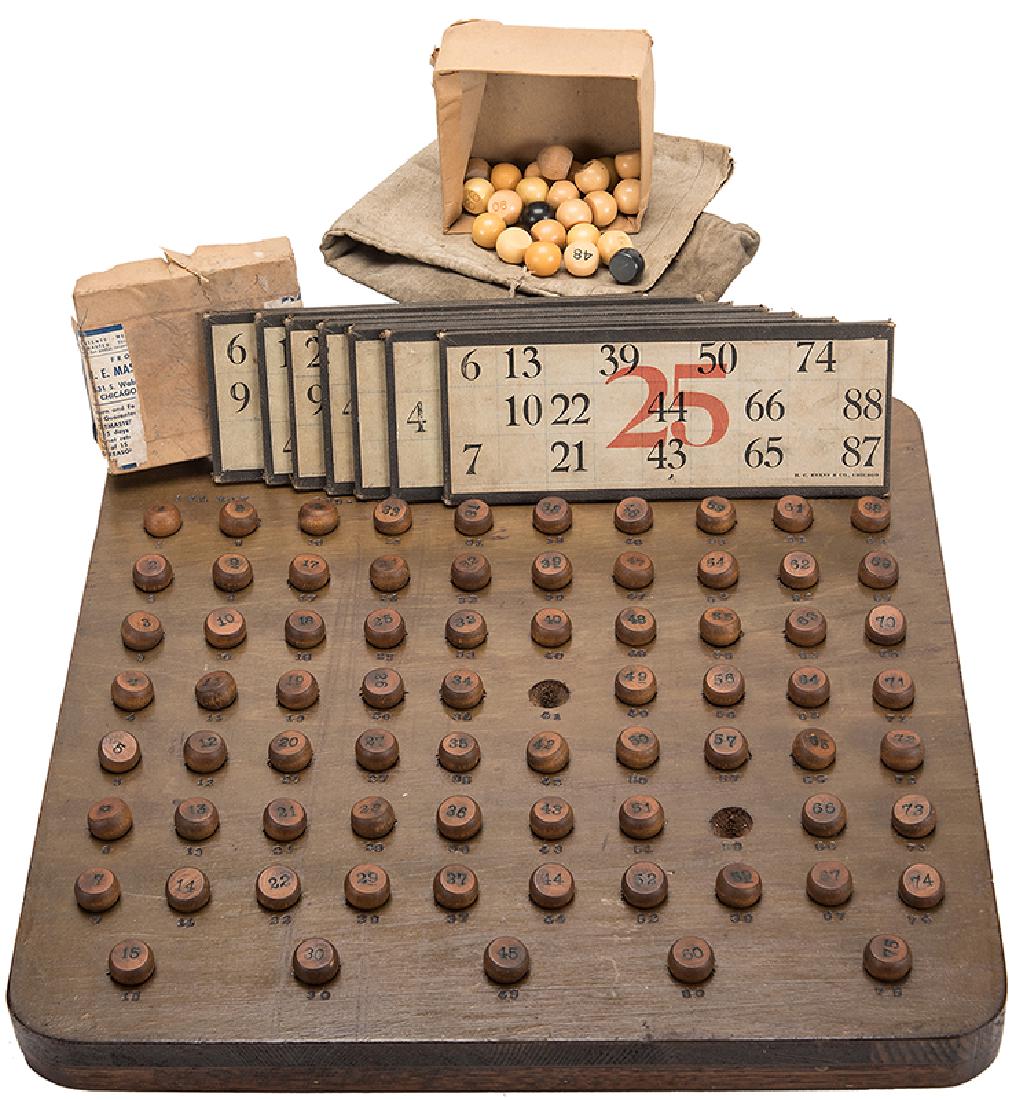 A Keno Ball Board With 73 (of 75) Wood Keno Balls, an